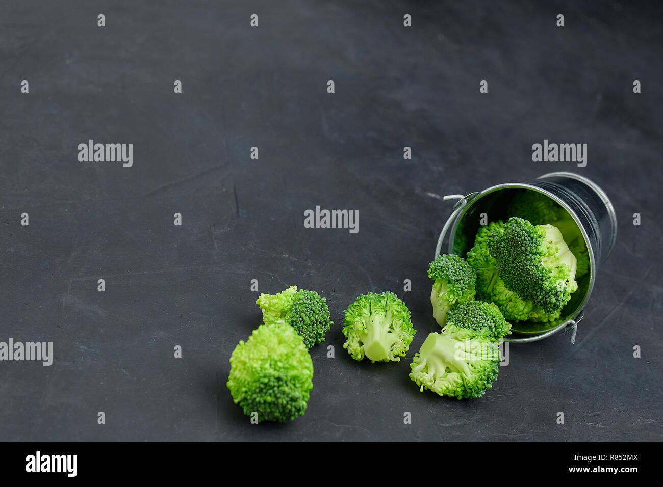 placer green broccoli segments from a small bucket. Healthy eating ...