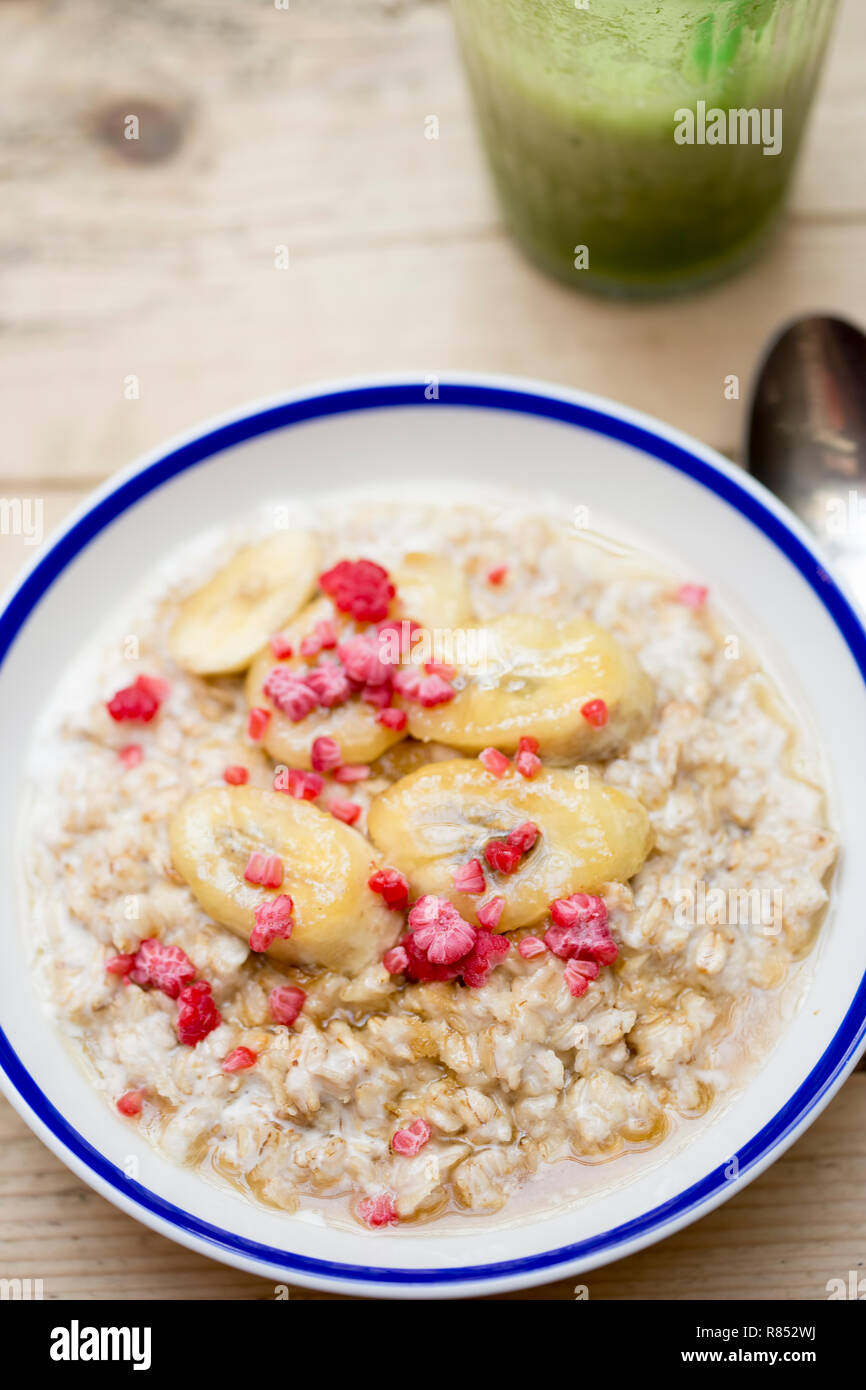 Porridge with bananas and raspberries Stock Photo - Alamy