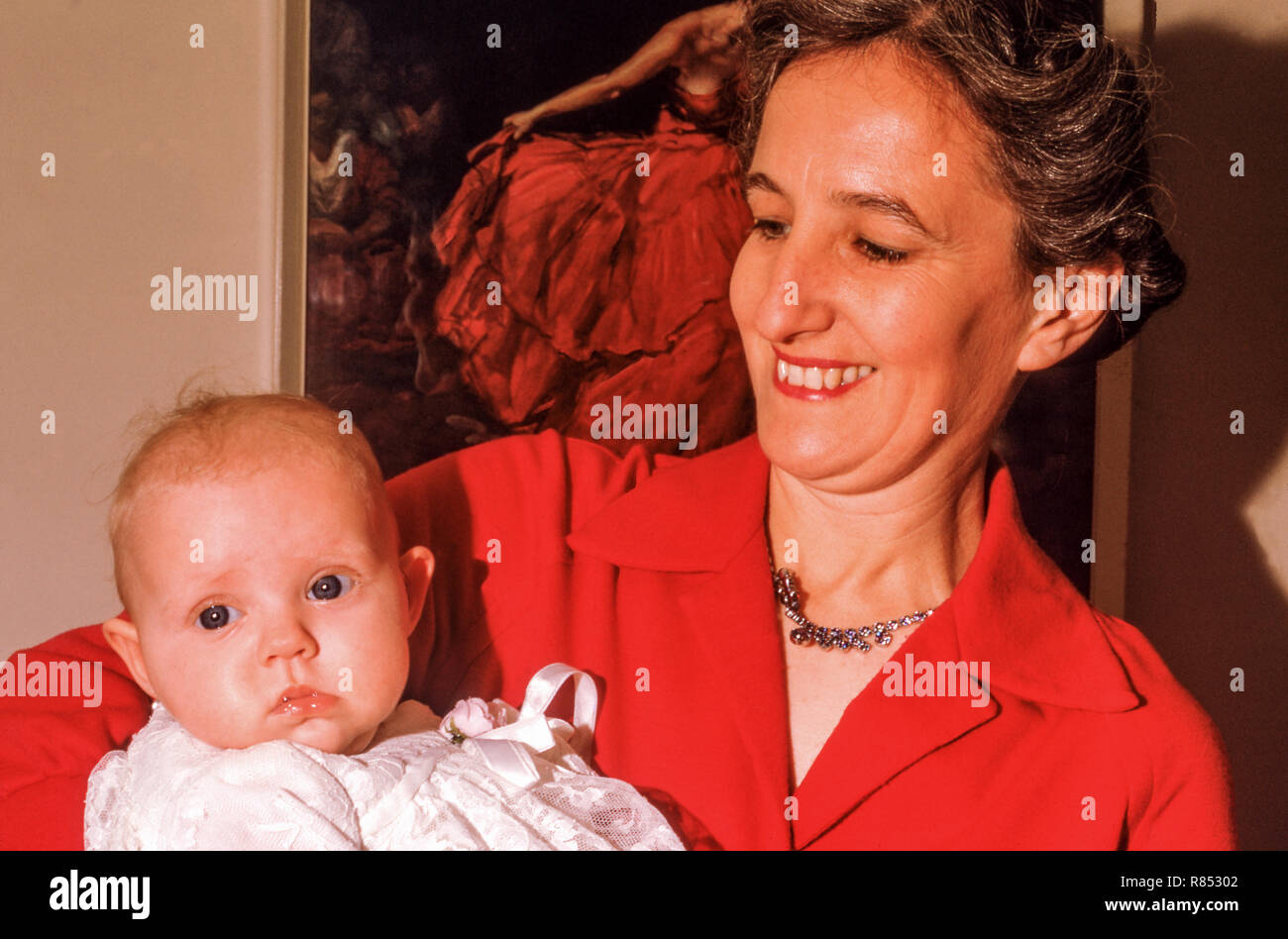 Godmother with godchild on Christening day Stock Photo - Alamy