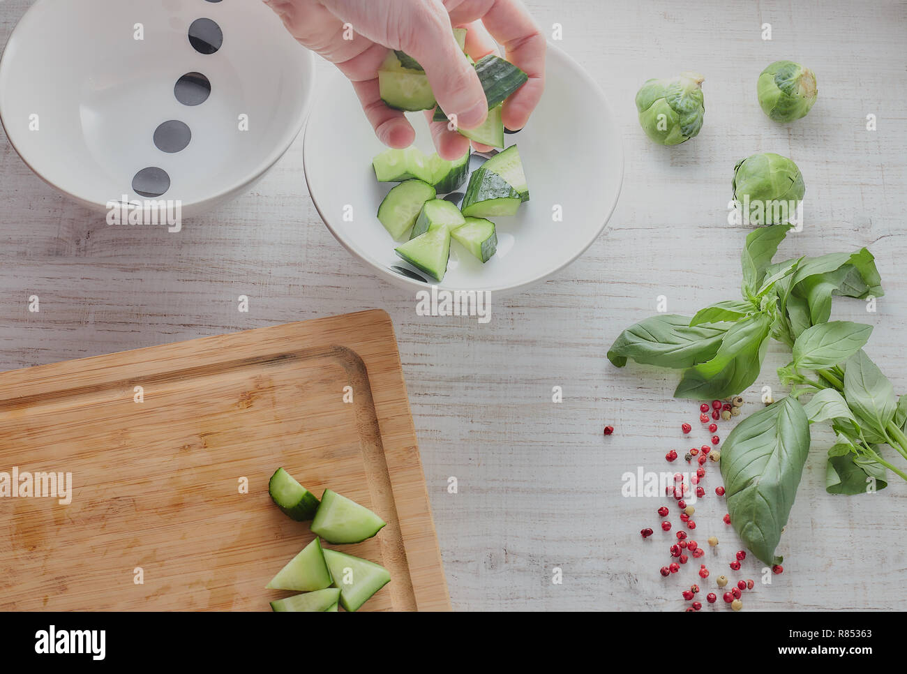 Human hands cooking vegetables salad in the kitchen. healthy food ...