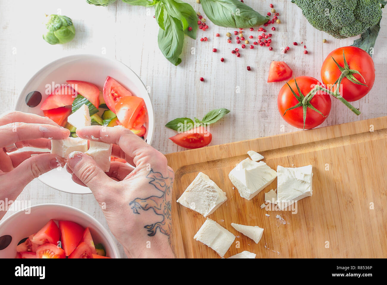 Human hands cooking vegetables salad in the kitchen. healthy food ...
