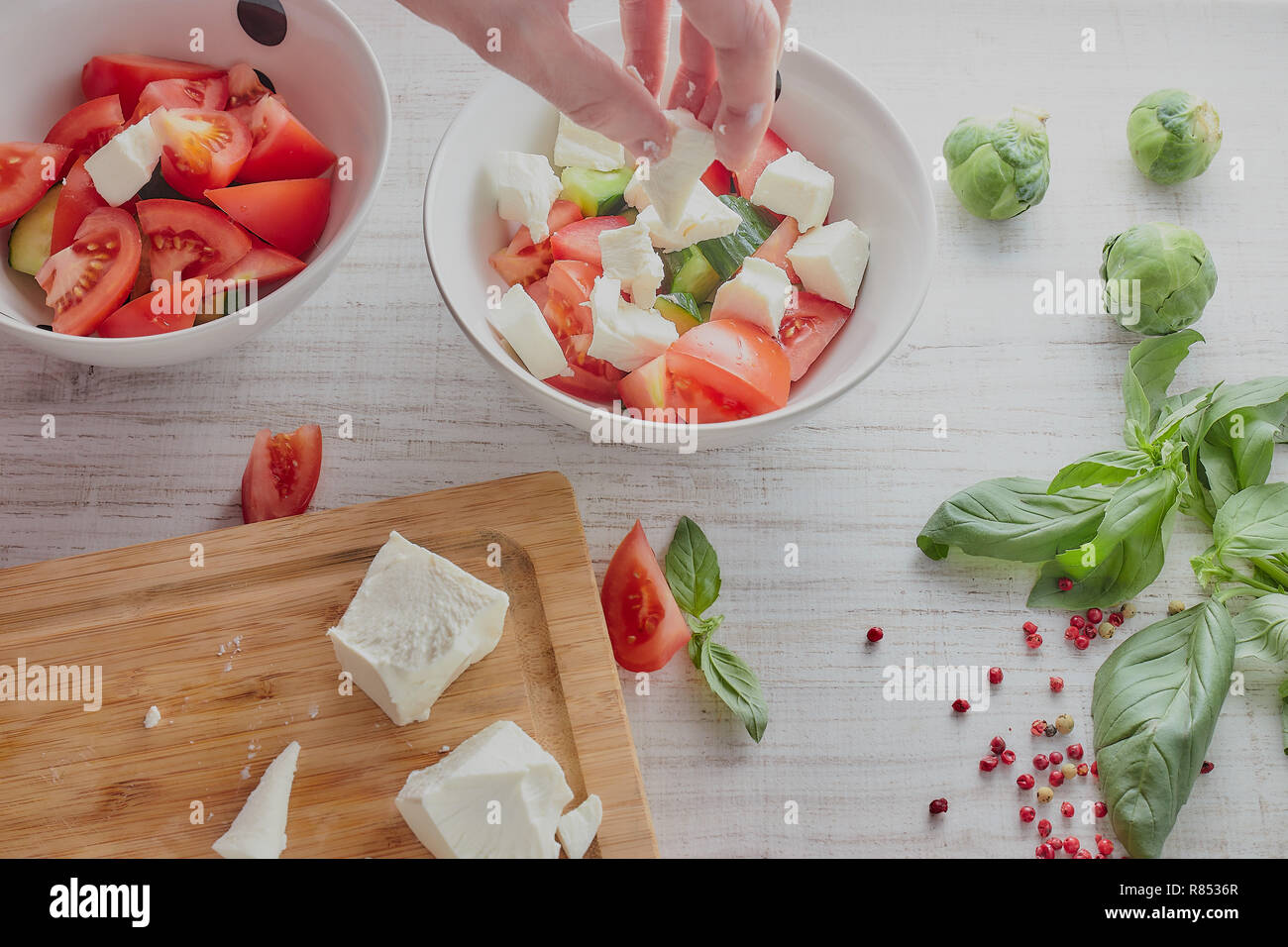 Human hands cooking vegetables salad in the kitchen. healthy food ...