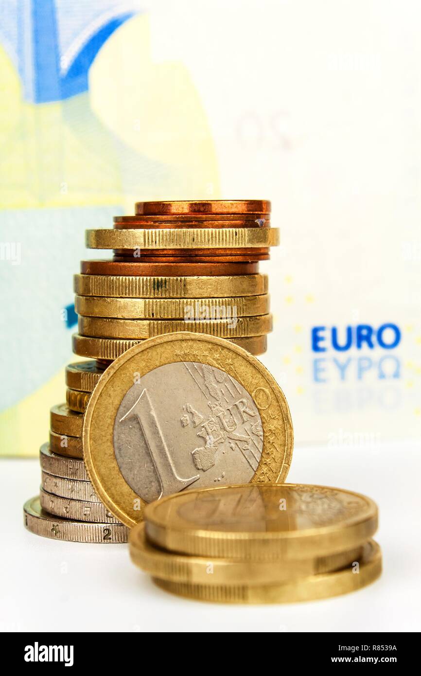 Euro coins and banknotes on a white background. Exchange rate. Stock ...