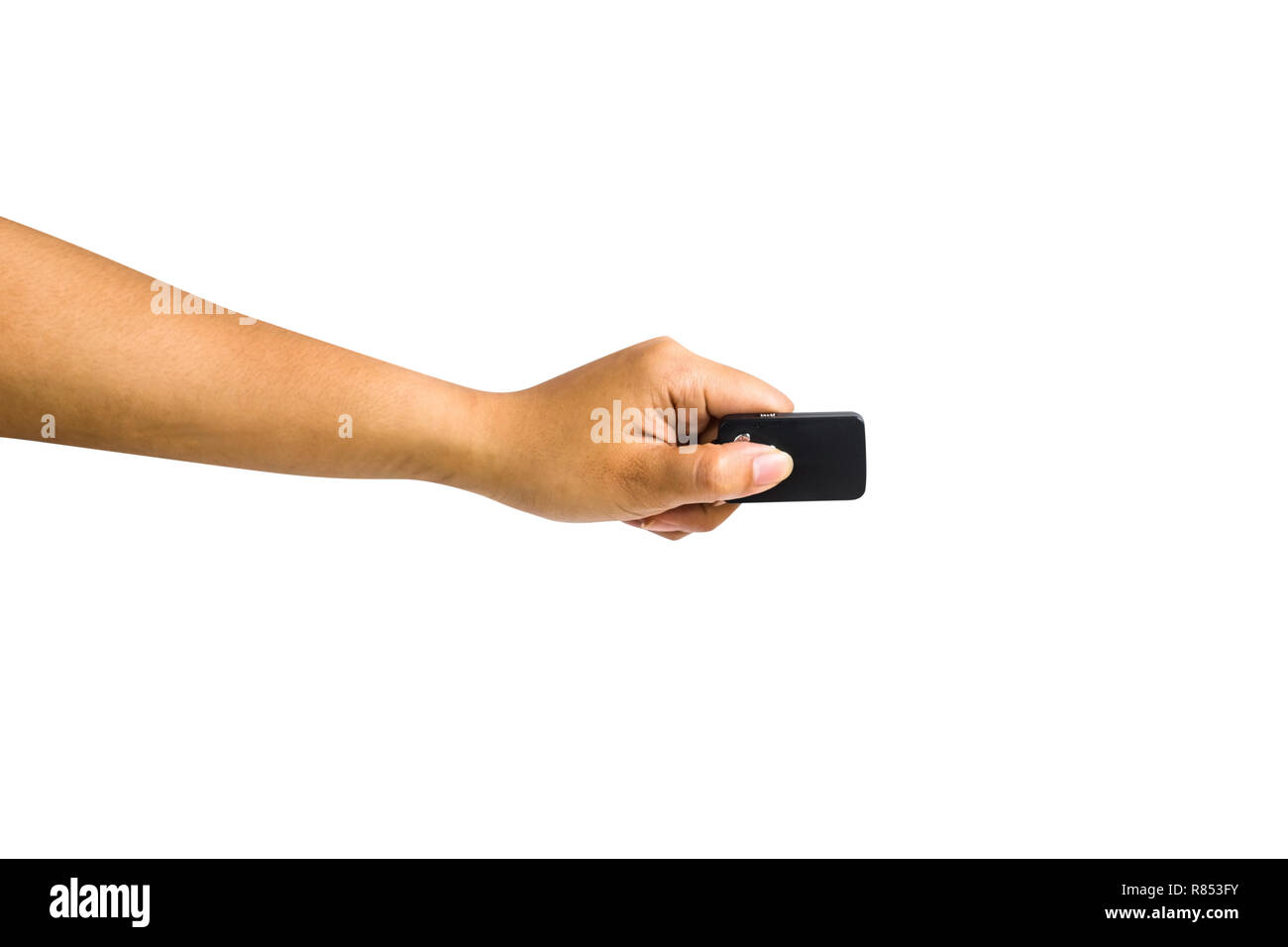 Cropped of a female hand holding black remote control isolated on white ...
