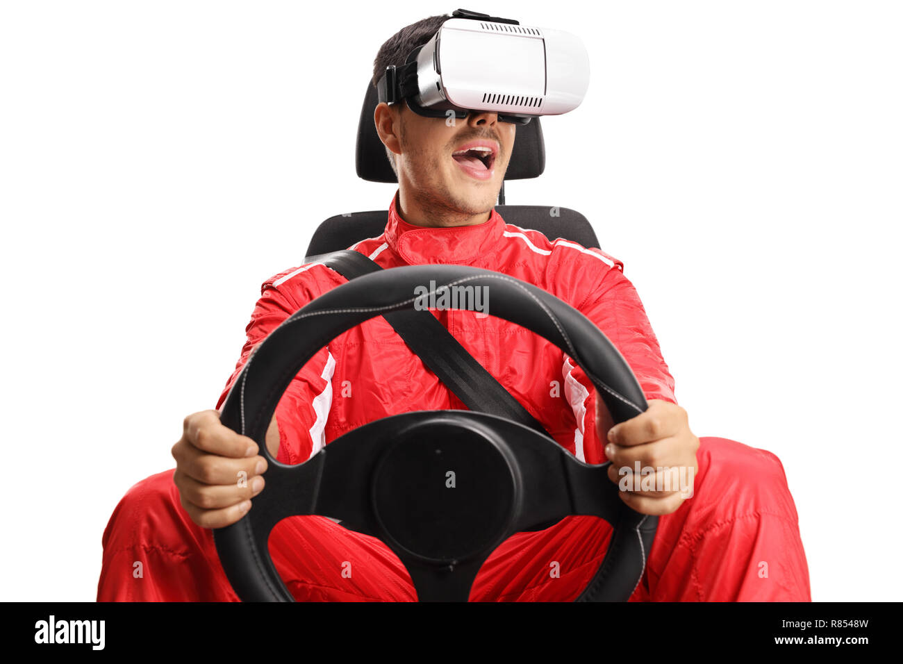Racer in a car seat holding a steering wheel and wearing VR headset ...