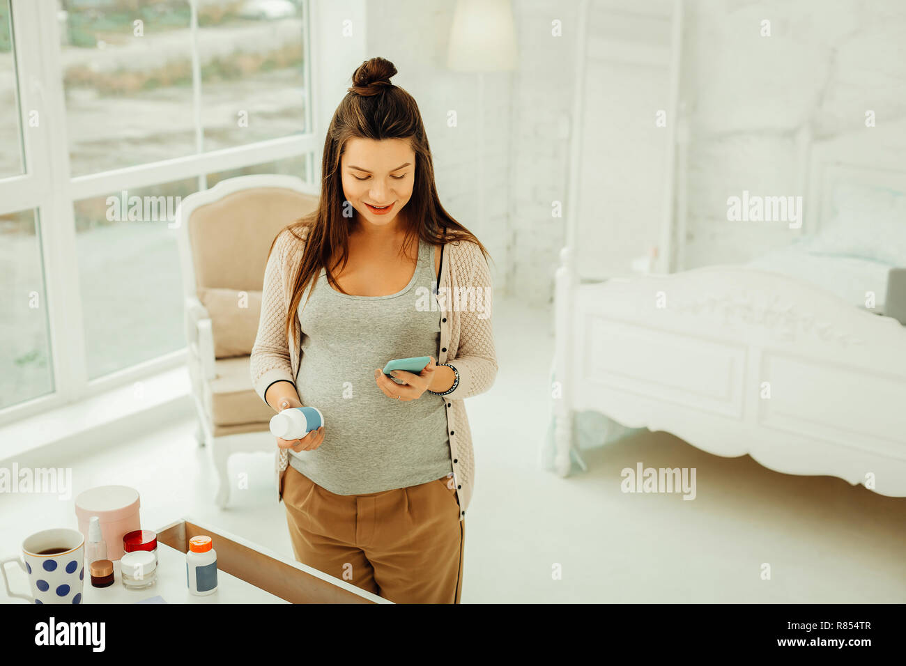 Ongoing assistance. Pregnant woman consulting with her family doctor ...