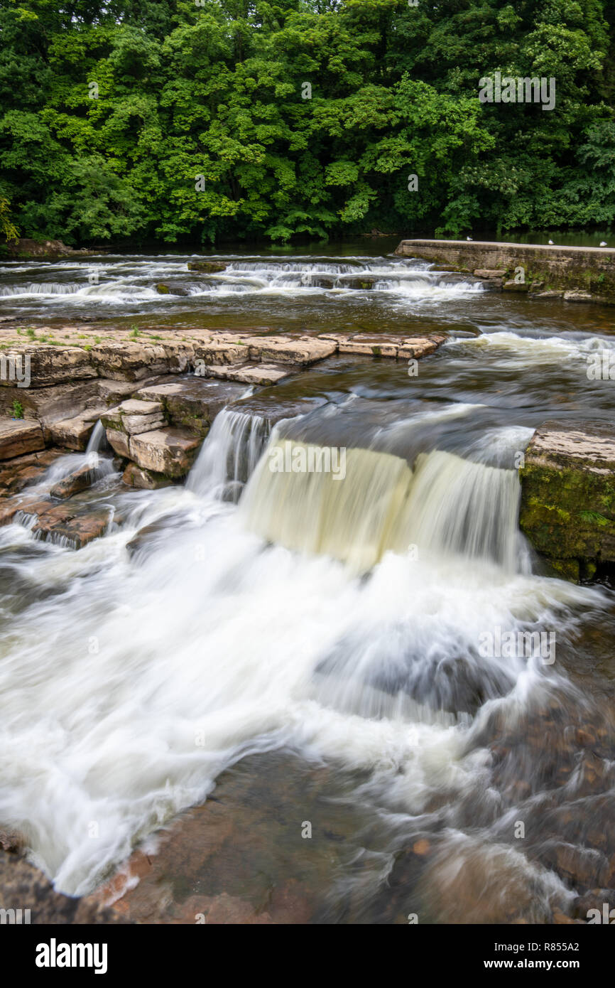 Water cascades through a series of small rapids, Richmond, Yorkshire ...