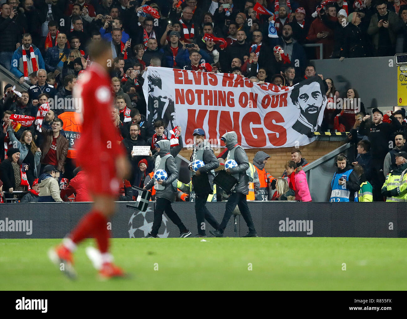 Liverpool fans in the stands holding a banner in support their players ...