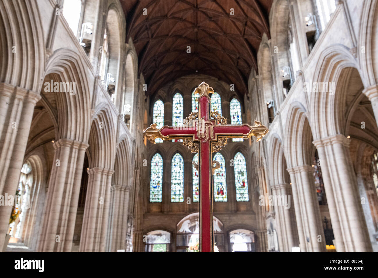 The reverse side of an ornate cross featuring the crucifix of Jesus ...