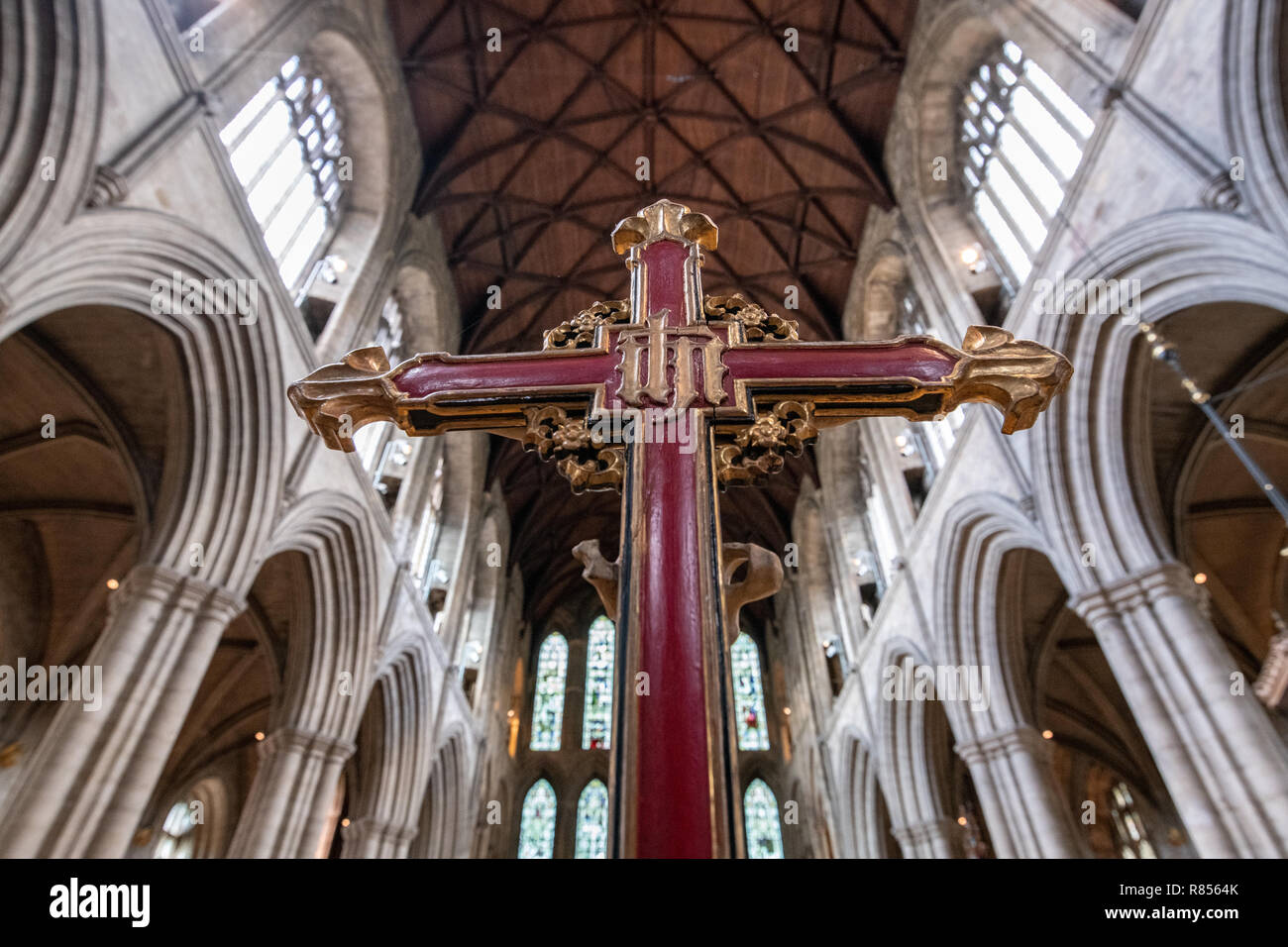 The reverse side of an ornate cross featuring the crucifix of Jesus ...