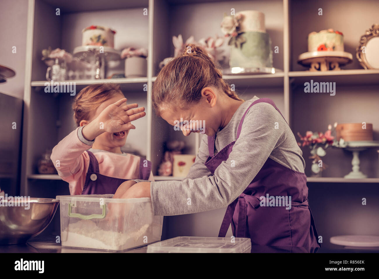 Playful mood. Happy cheerful girls playing with each other while ...