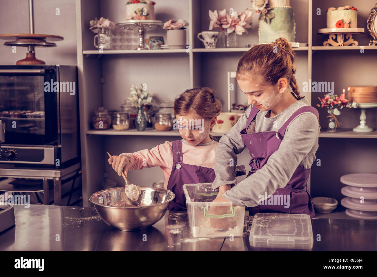 Cooking skills. Positive pretty girls studying in the cooking academy ...
