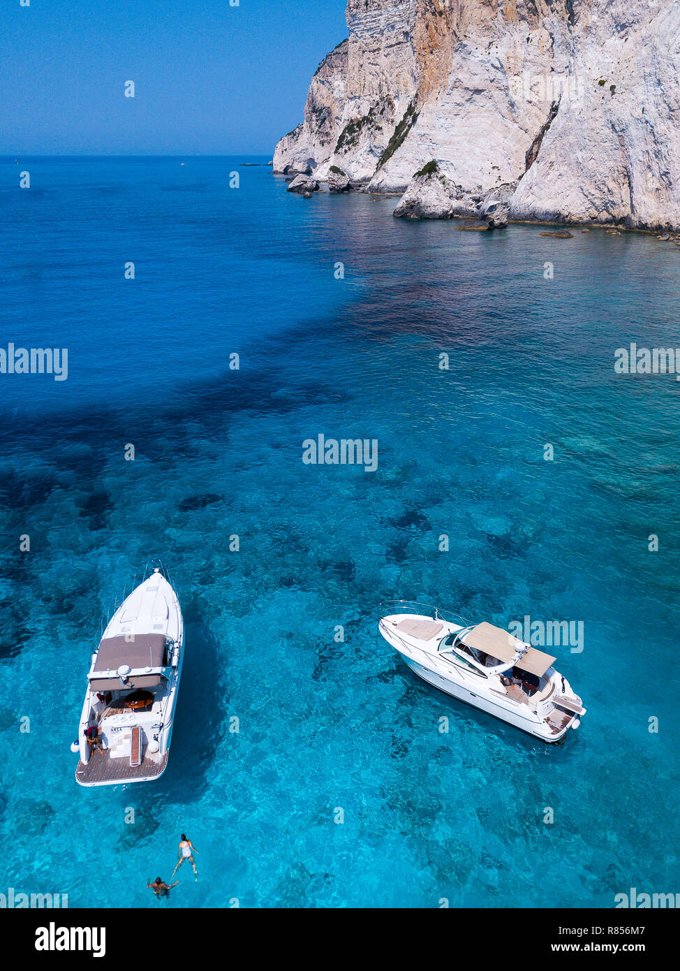 Boats moored in Erimitis Bay, Paxos, Greece Stock Photo - Alamy