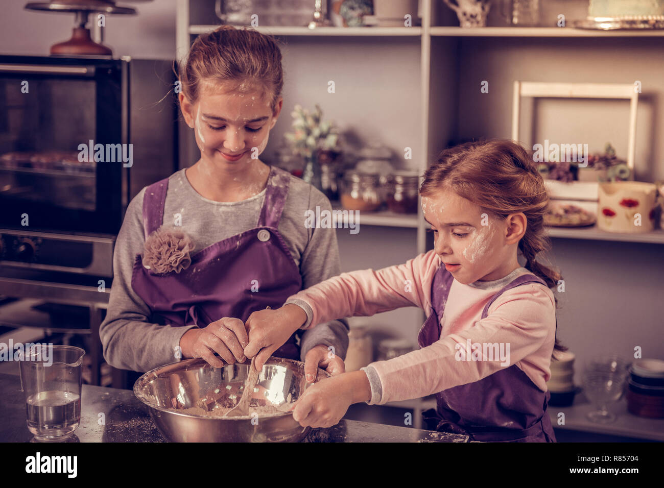 Close up sisters cooking hi-res stock photography and images - Alamy