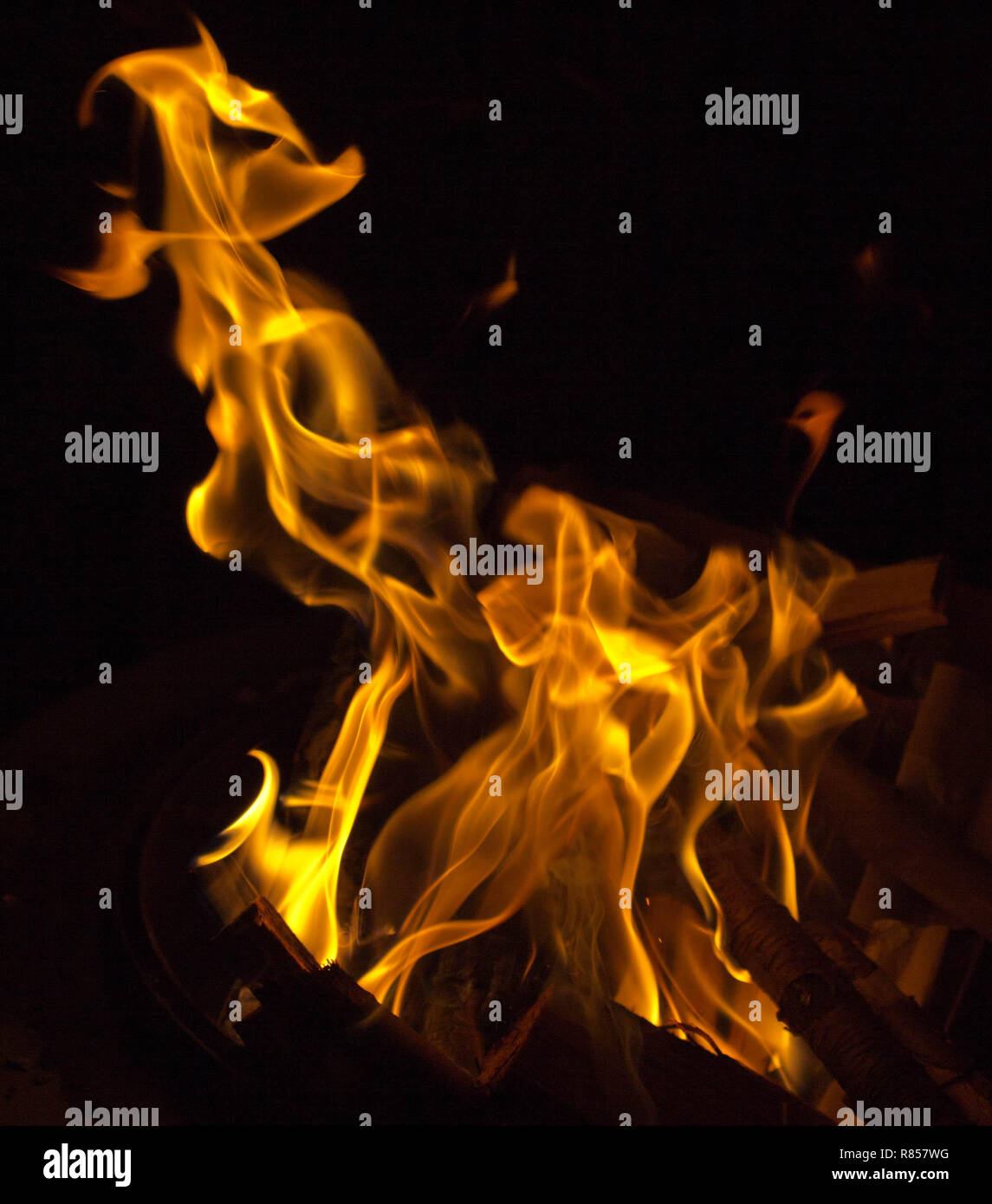 A warm and cozy fire in the dark night Stock Photo - Alamy