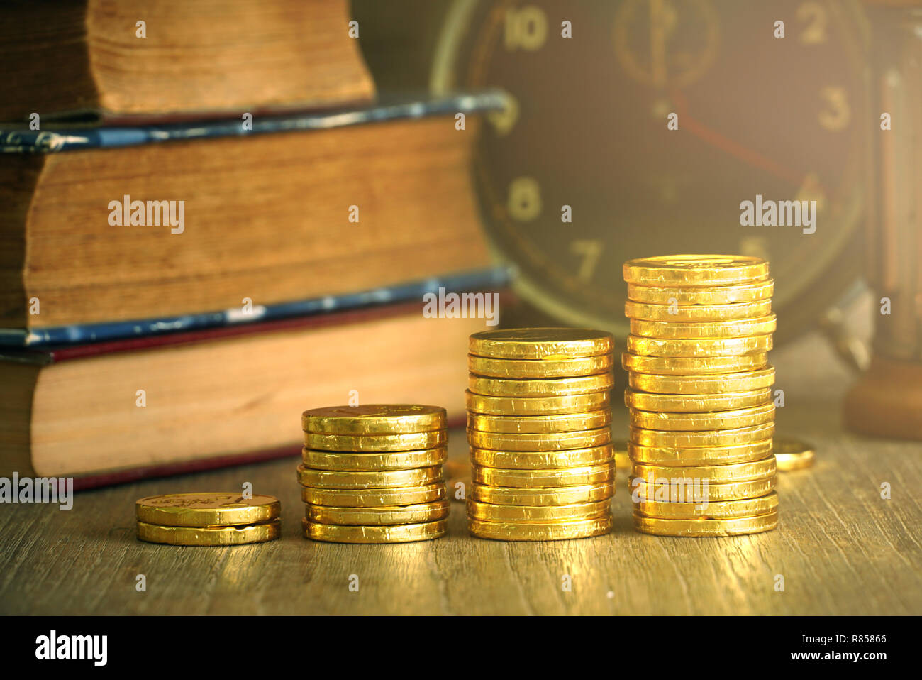 Gold coin stack on working table Stock Photo - Alamy