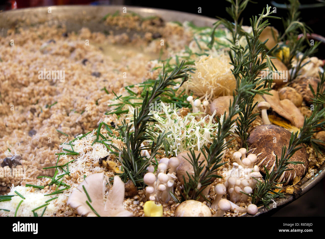 Wild mushrooms and rosemary cooking in spelt risotto at Borough Market ...
