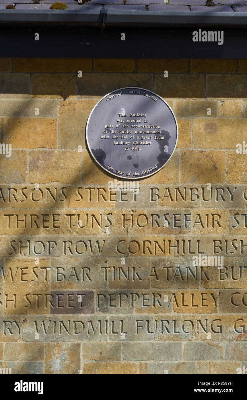 Carved inscriptions on the exterior wall of refurbished public ...