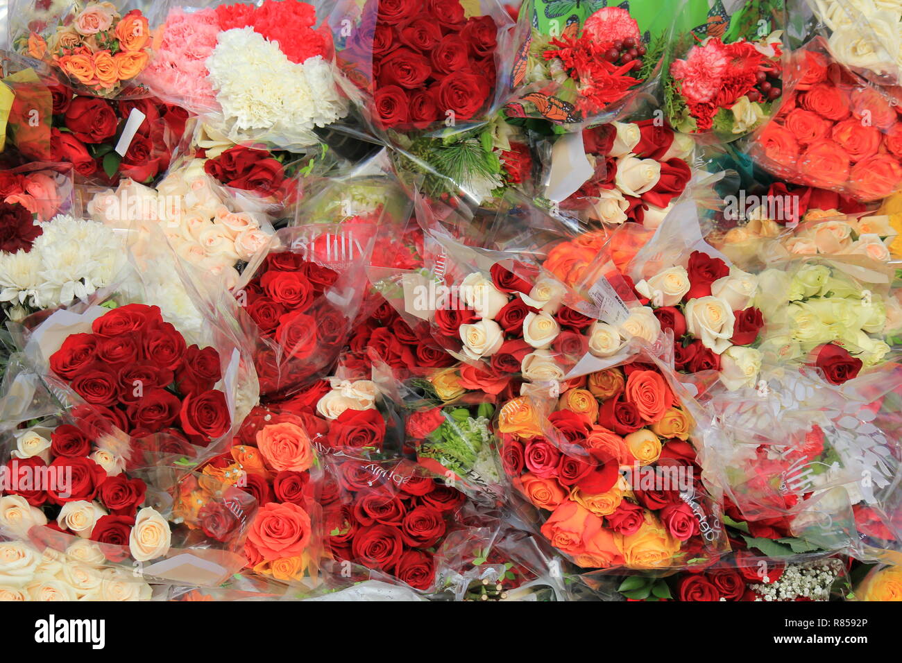 Stacks, piles, and a wall full of a variety of showy bouquets of ...