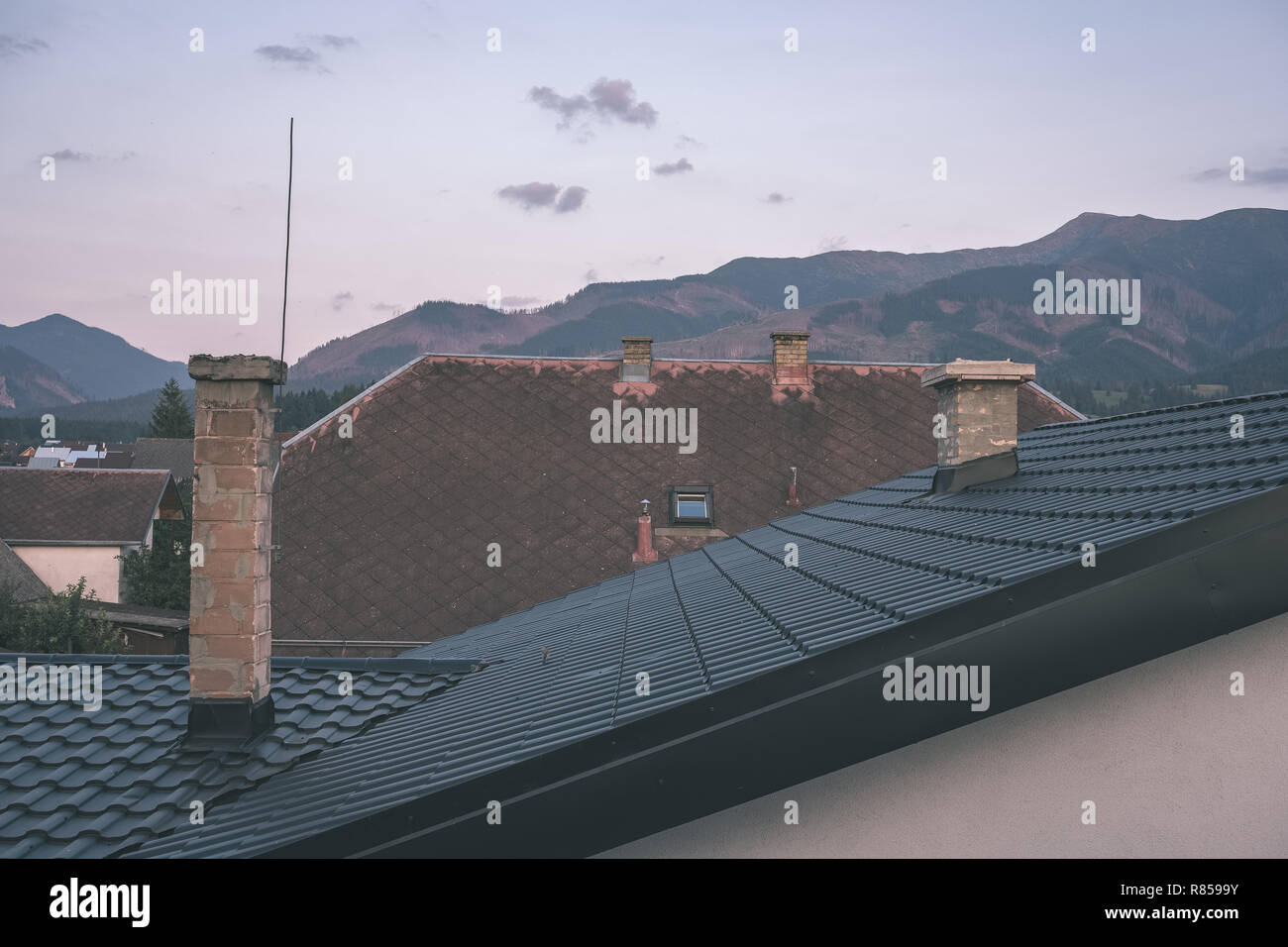 country village rooftops in Slovakia with mountains in background ...