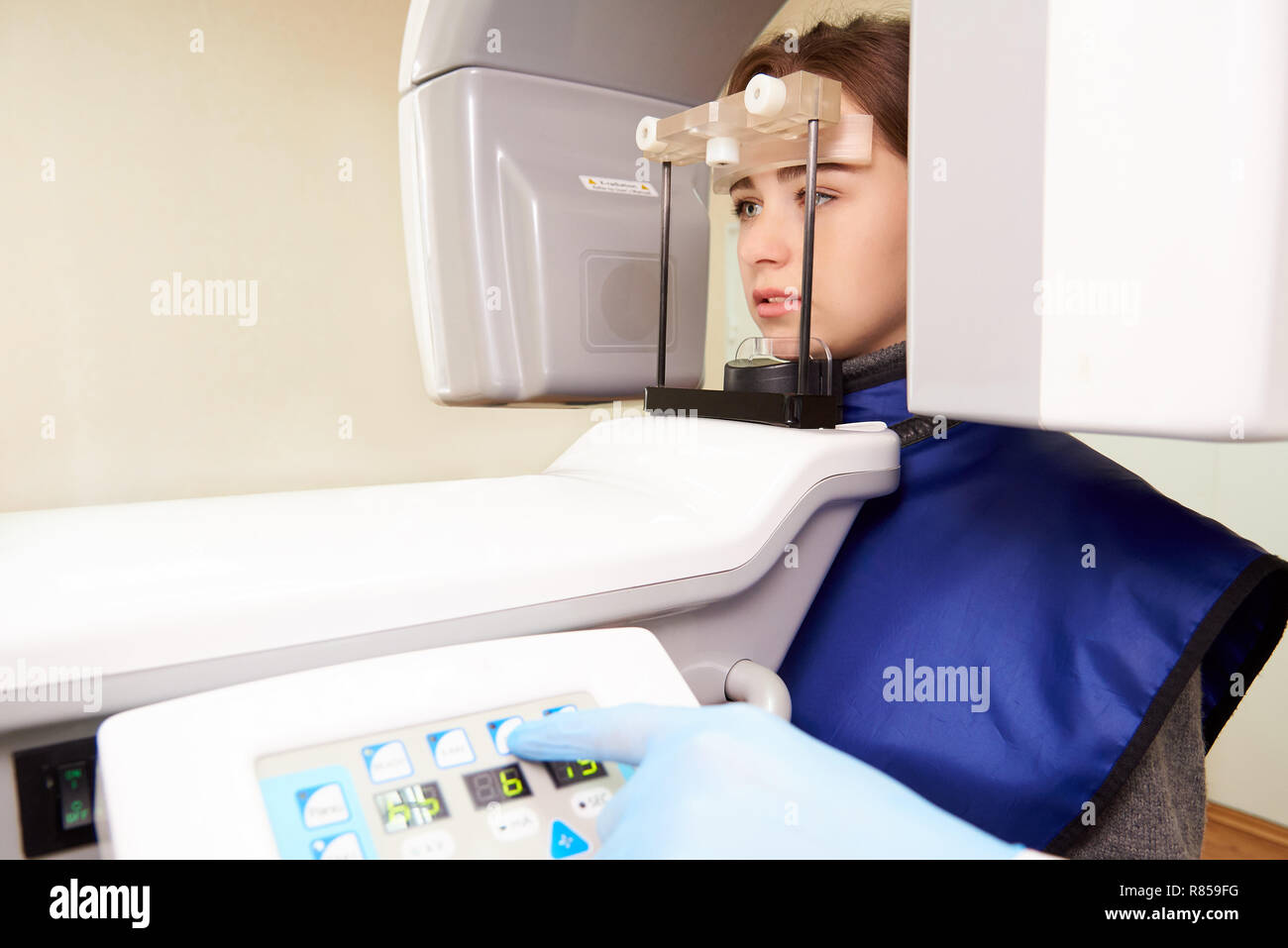 Patient standing in x-ray machine. Panoramic radiography.Computed ...