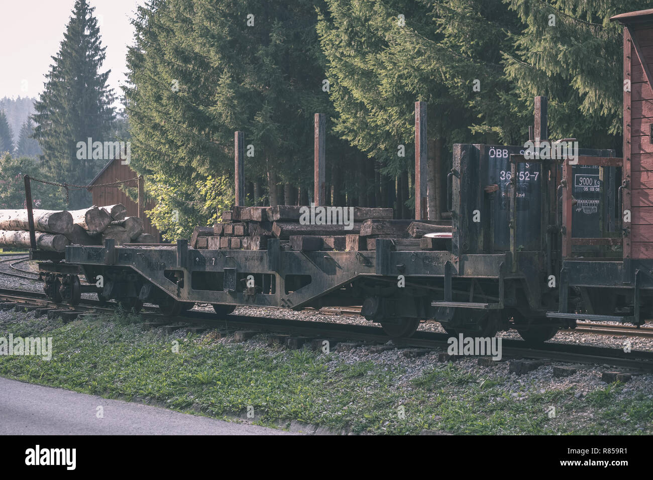 ancient log wood railway and train on the tracks. tourist attraction ...