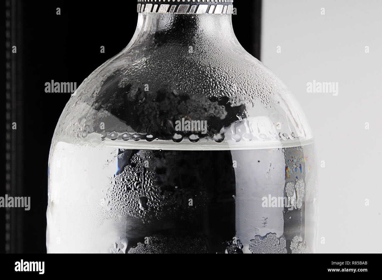 Bottle with transparent liquid Stock Photo - Alamy