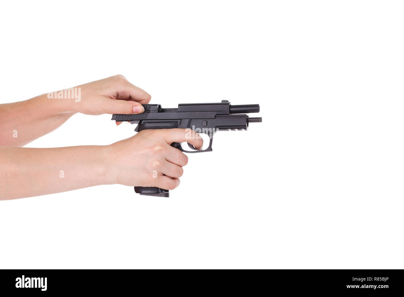 White hand holds gun isolated on white background Stock Photo - Alamy