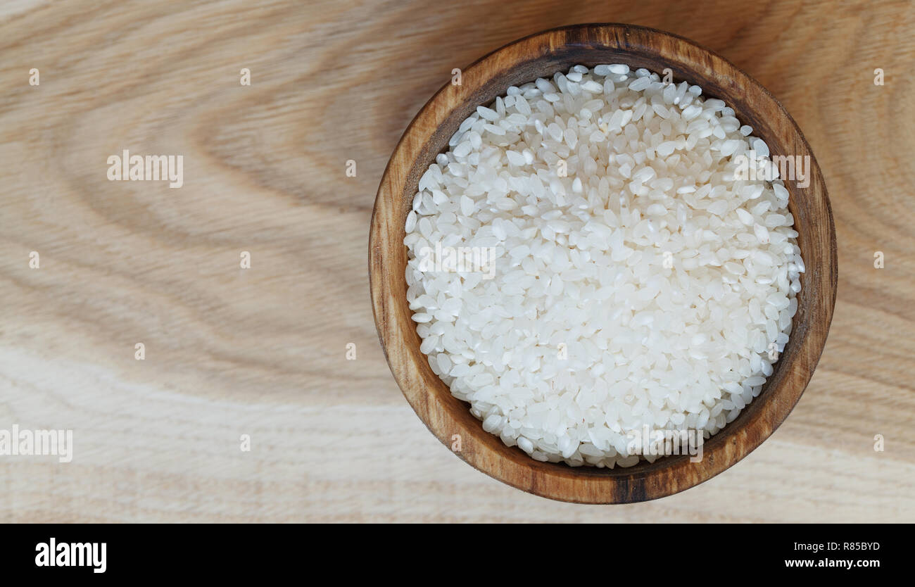Rice in a wooden plate, horizontal view from above, rustic Stock Photo ...