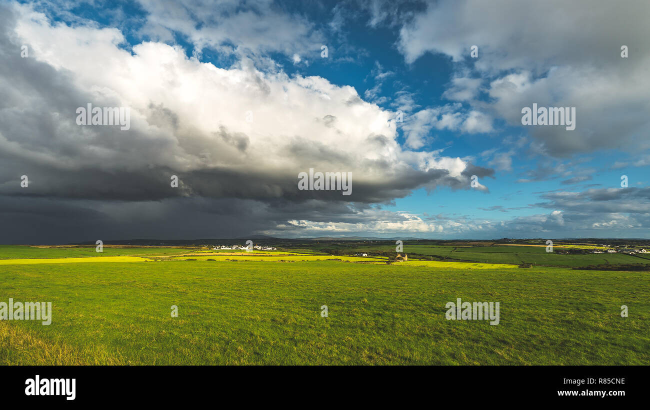Heavy rainy clouds over the Northern Ireland field. Stunning ...