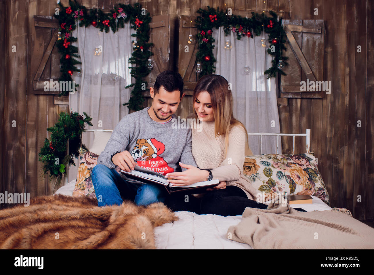 Spending nice time at home. Beautiful young loving couple bonding to ...