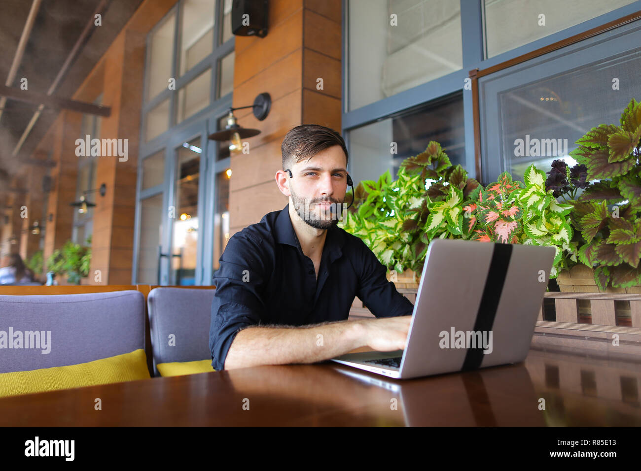 Internet consultant talking to client with web camera and microp Stock ...