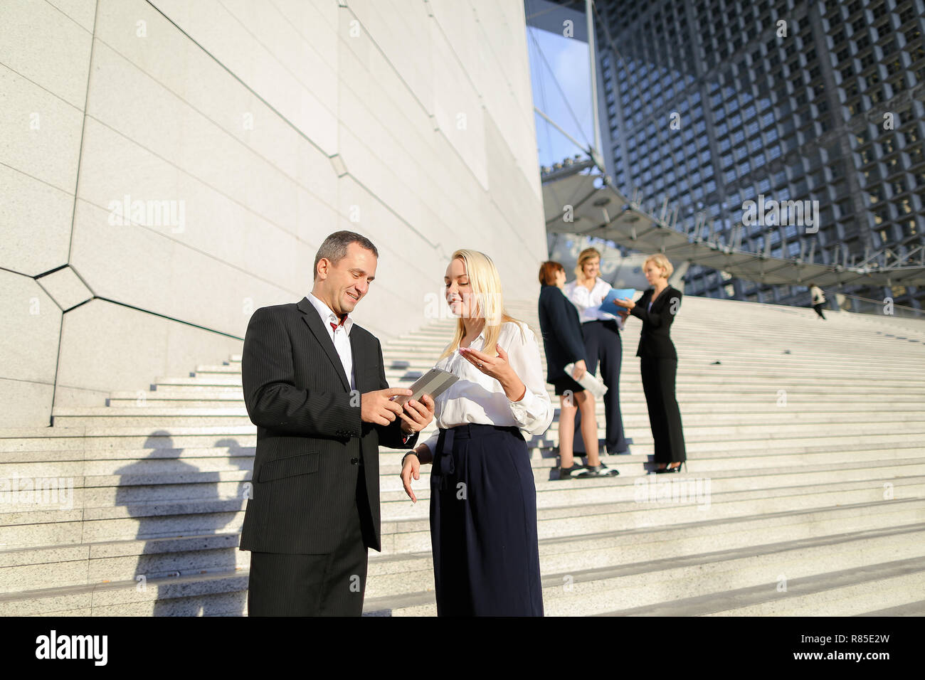 Foreign business colleagues in official journey talking and keep Stock ...