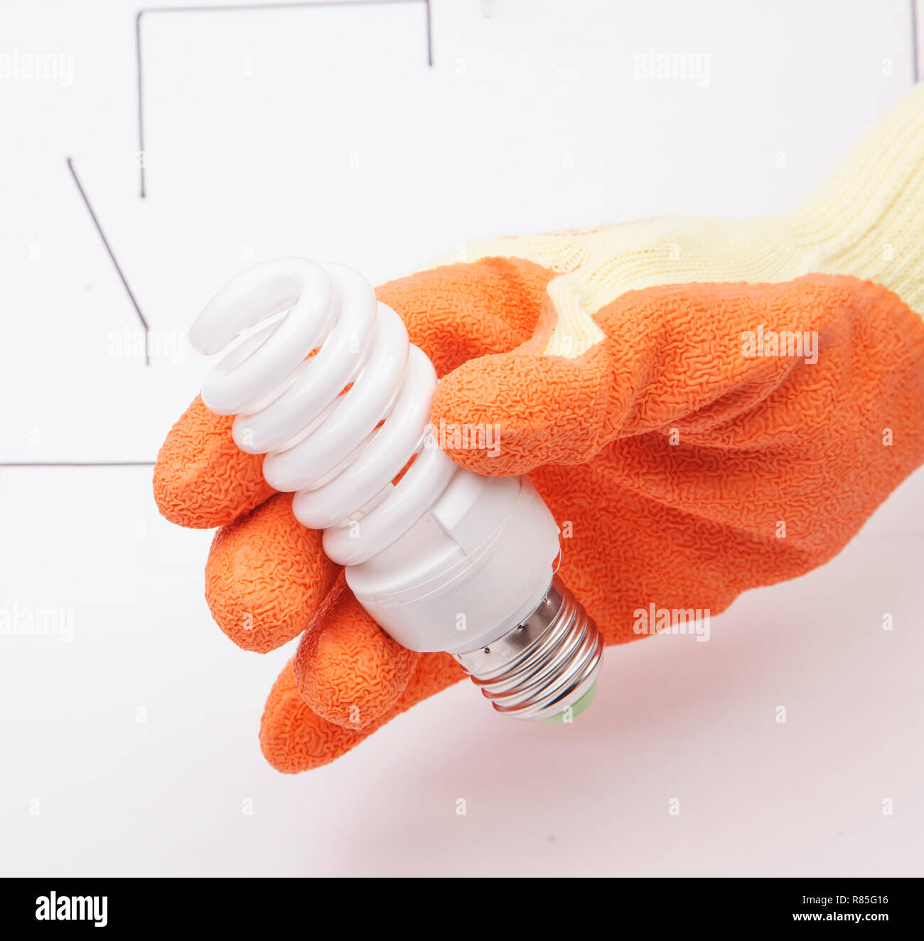 Hand hold electric clamps on a background of the electric scheme Stock ...