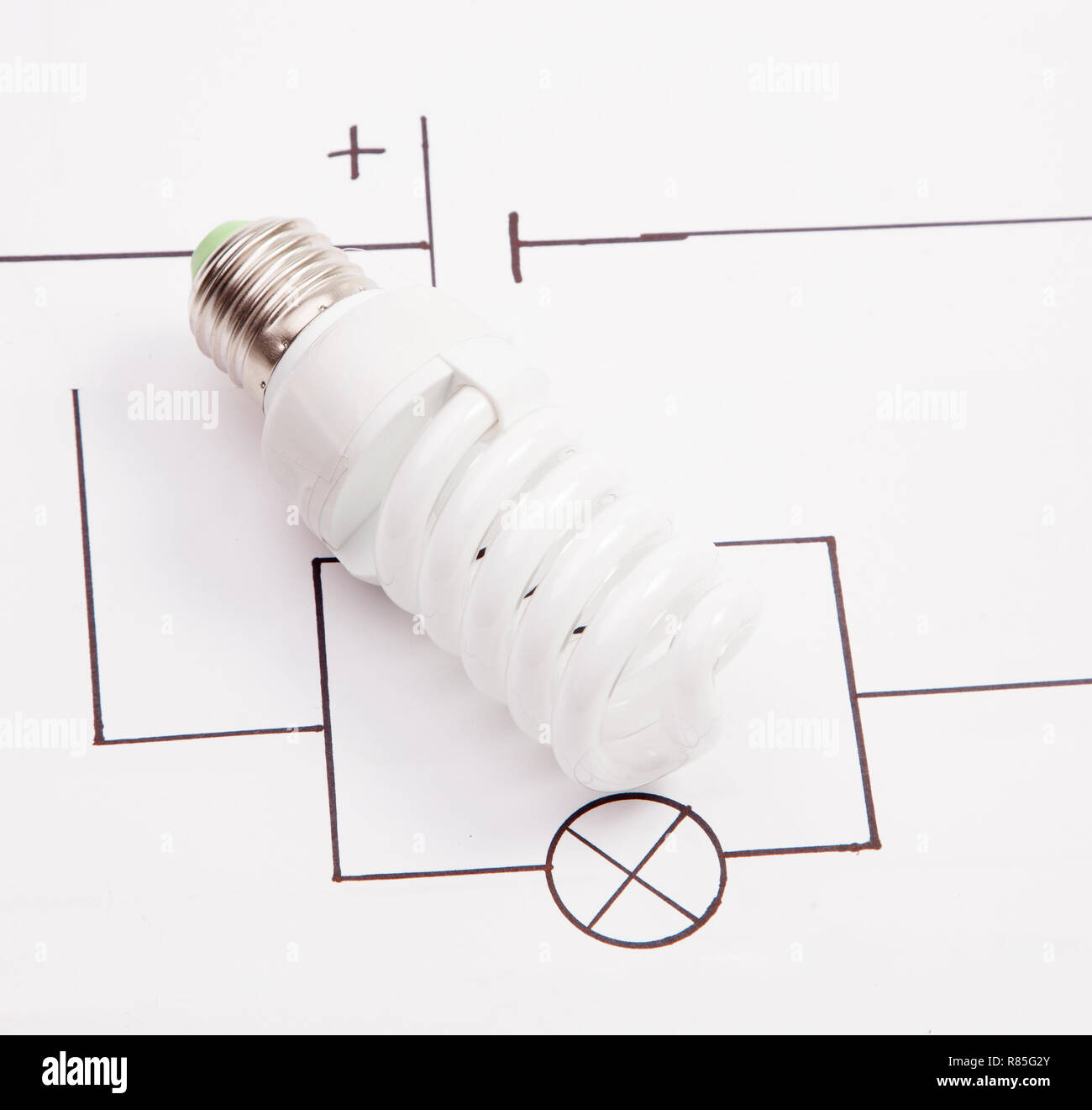 White energy saving lamp on a background of the electric scheme Stock ...