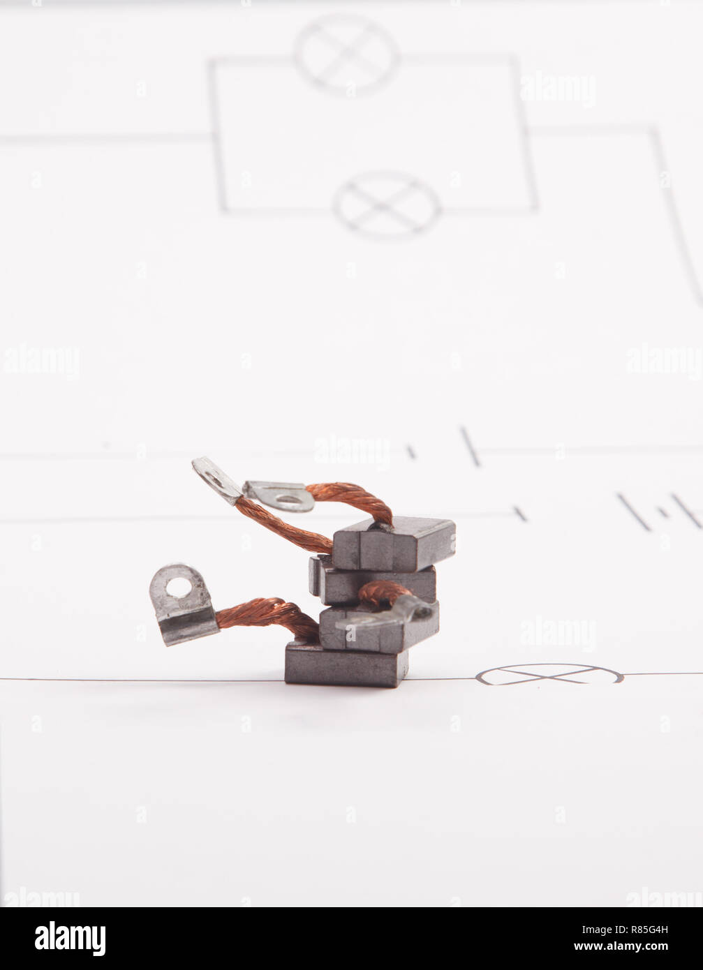 Electrical. carbon brush on a background of the electric scheme Stock ...