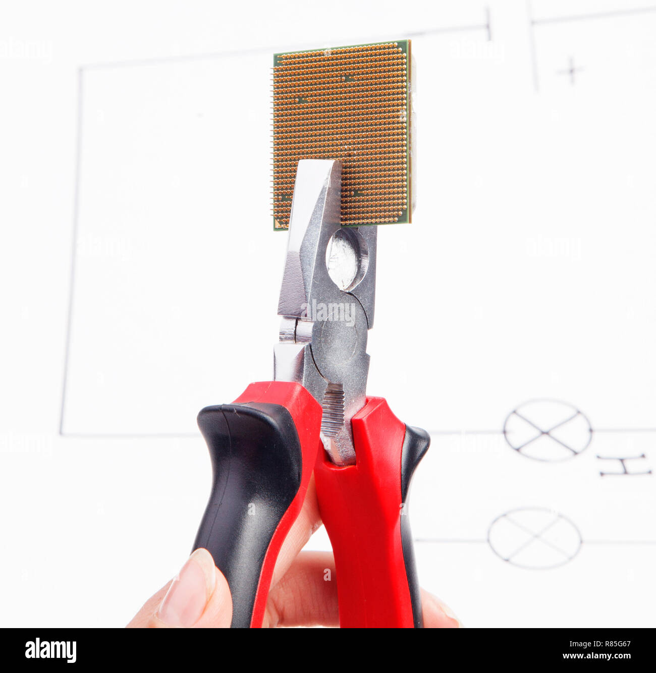Modern central computer processors CPU clamped in the pliers Stock ...