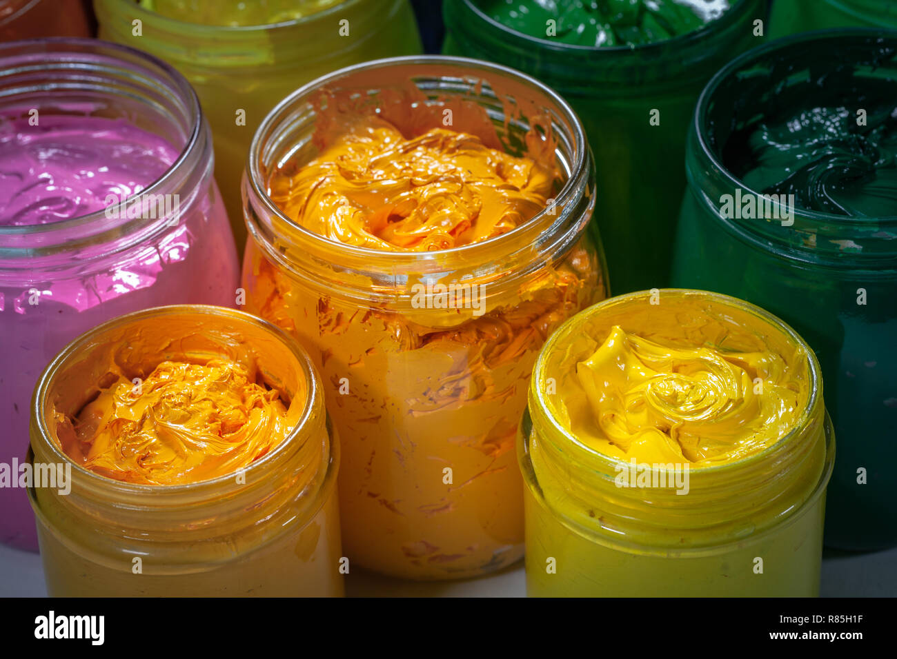yellow and orange colors of screen printing ink for print on tee shirts ...