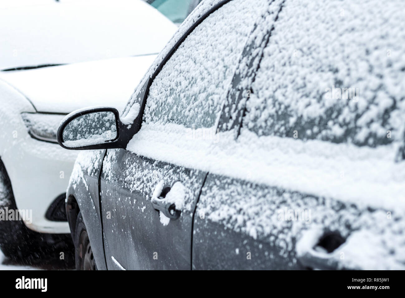 Car in snow on parking in winter Stock Photo - Alamy