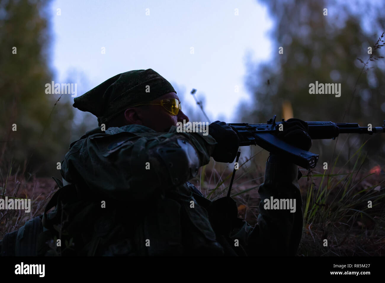Sniper team armed with large caliber, sniper rifle, shooting enemy ...