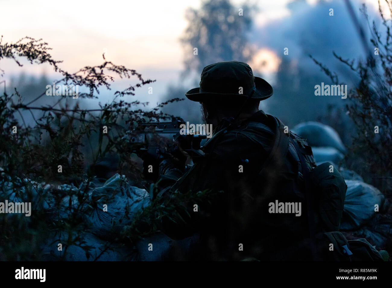 Sniper team armed with large caliber, sniper rifle, shooting enemy ...