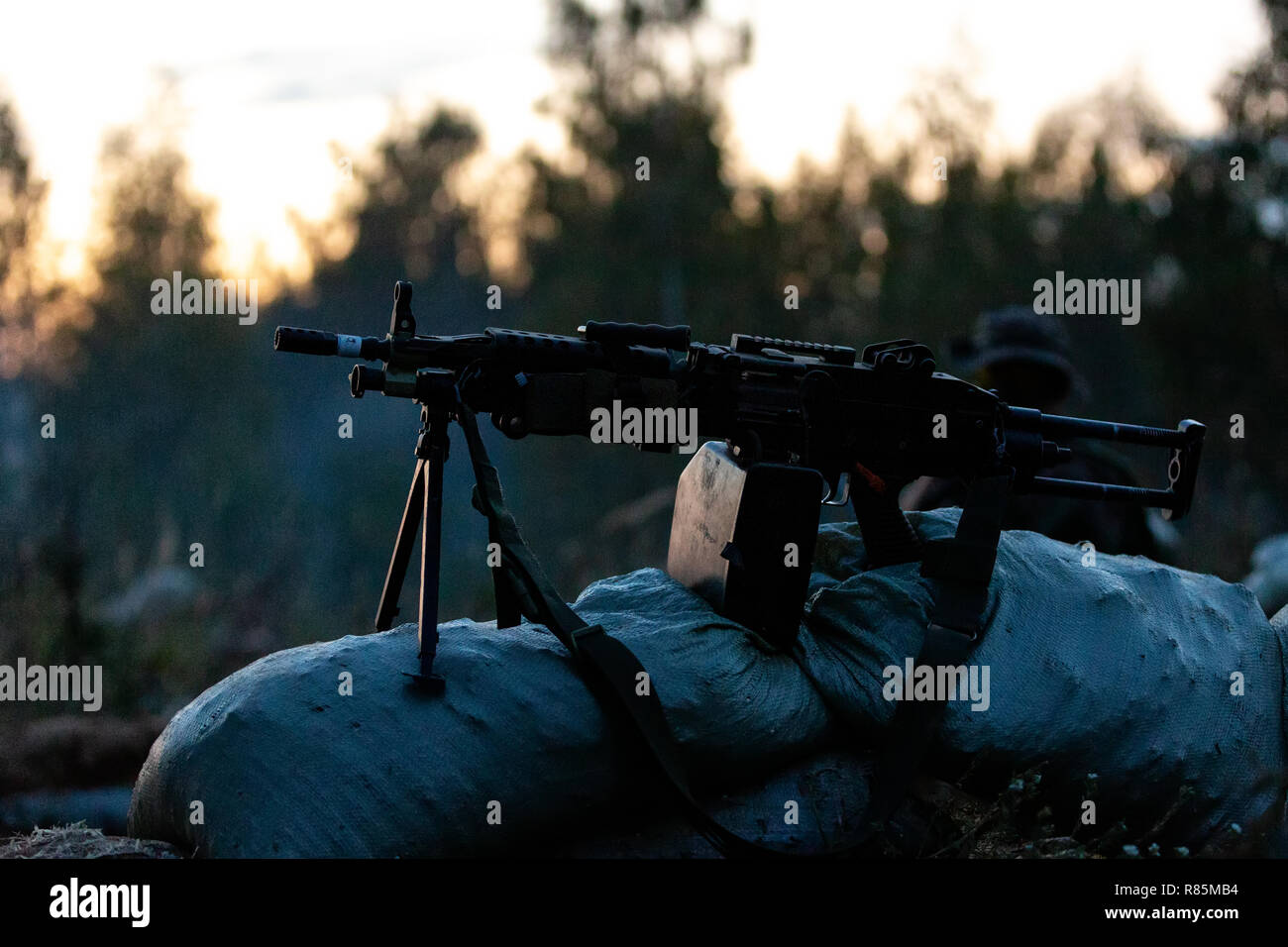Sniper team armed with large caliber, sniper rifle, shooting enemy ...