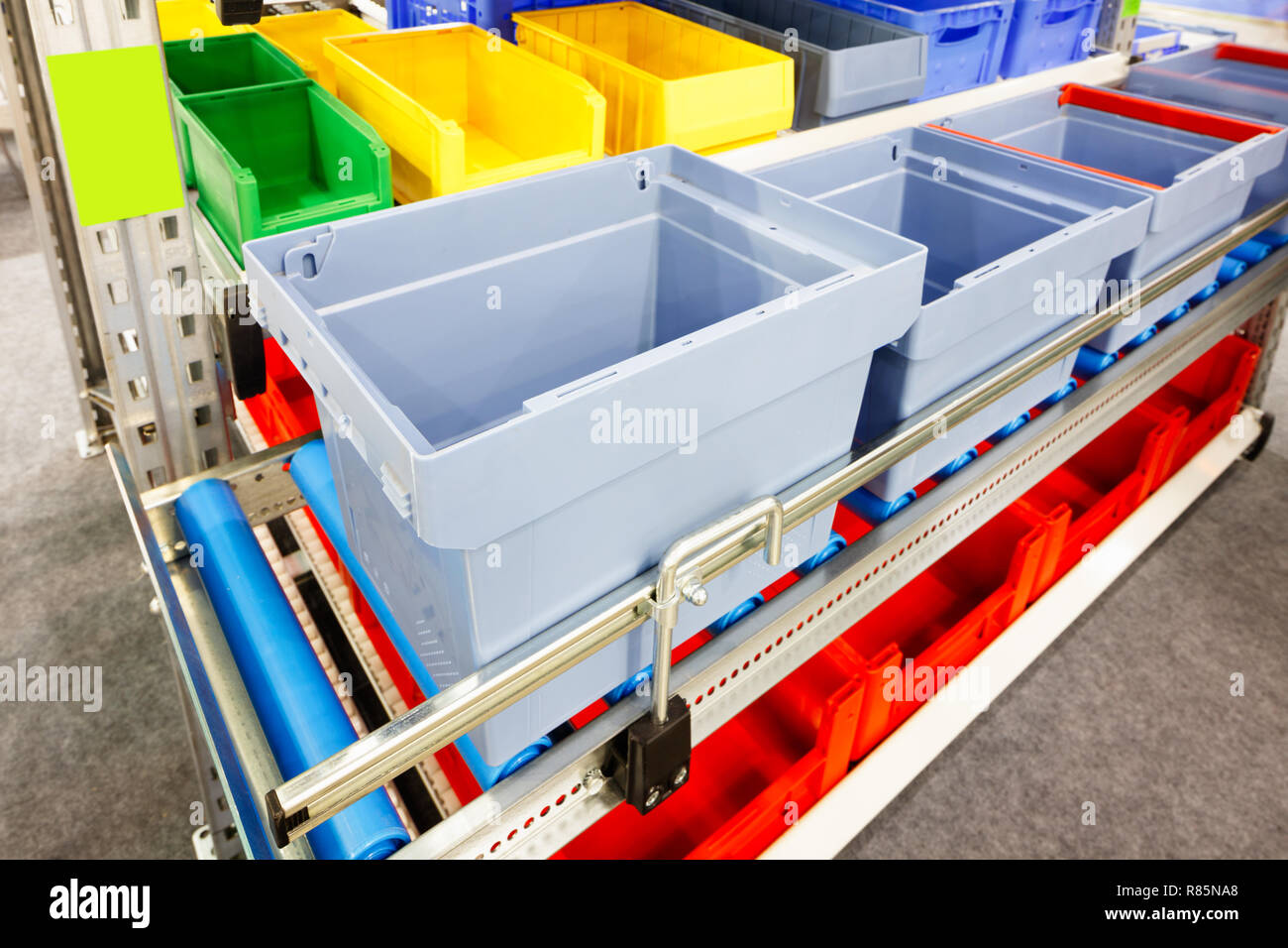 Automated storage warehouse with blue plastic crates Stock Photo - Alamy