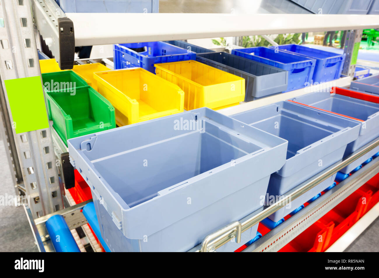 Automated storage warehouse with blue plastic crates Stock Photo - Alamy