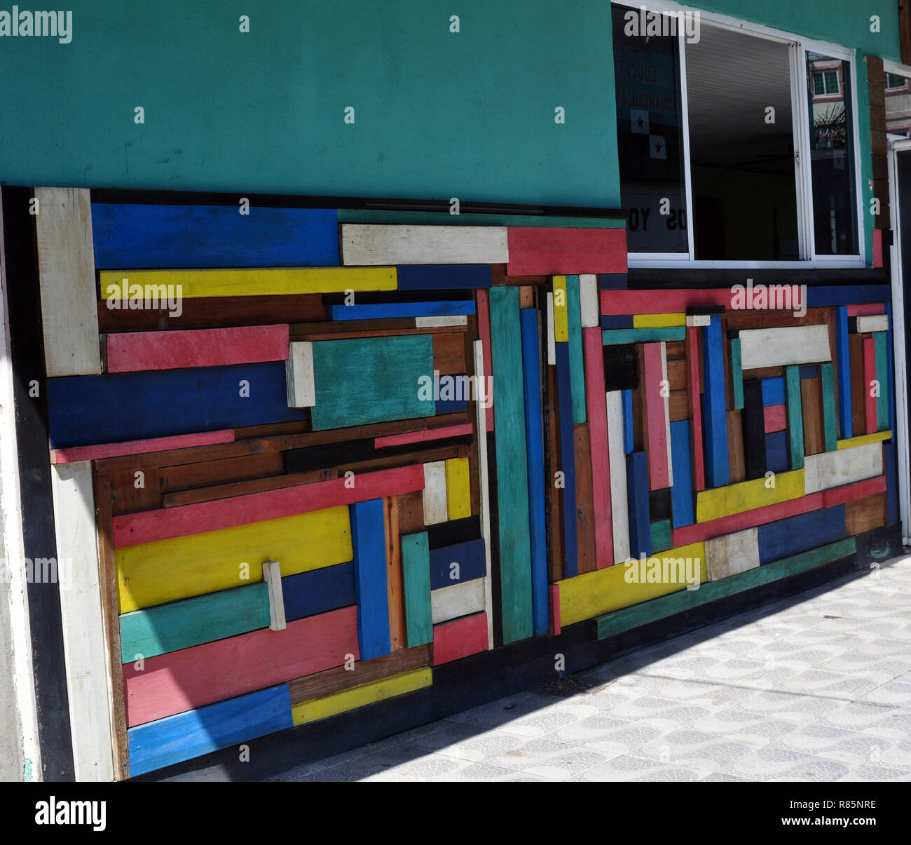 A Colorful Wall made with different colored boards that go in different ...