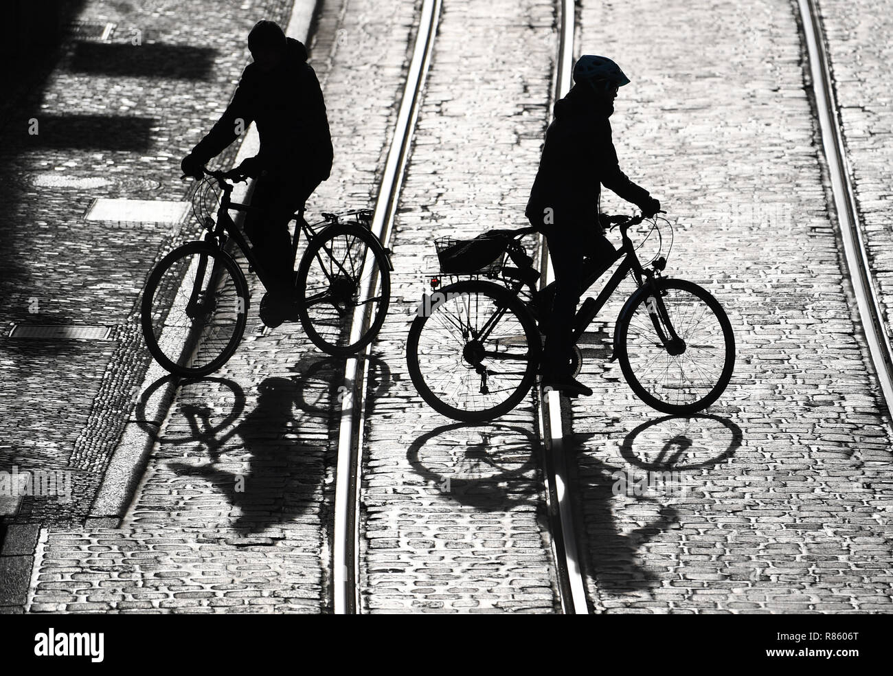 Freiburg, Germany. 22nd Mar, 2018. Two cyclists cycling on a ...
