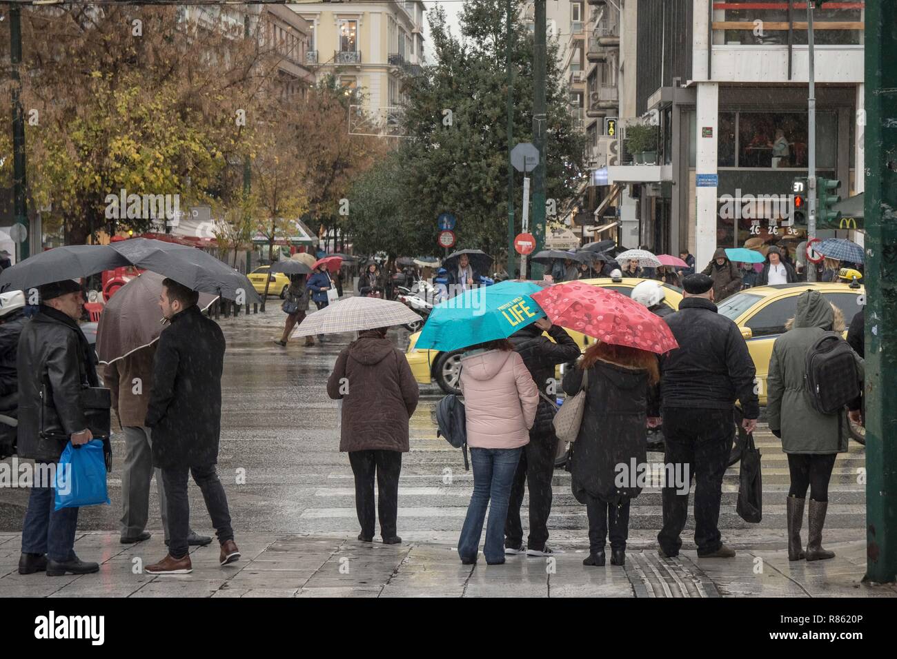 Athens, Greece. 13th Dec, 2018. People seen with umbrellas at the ...