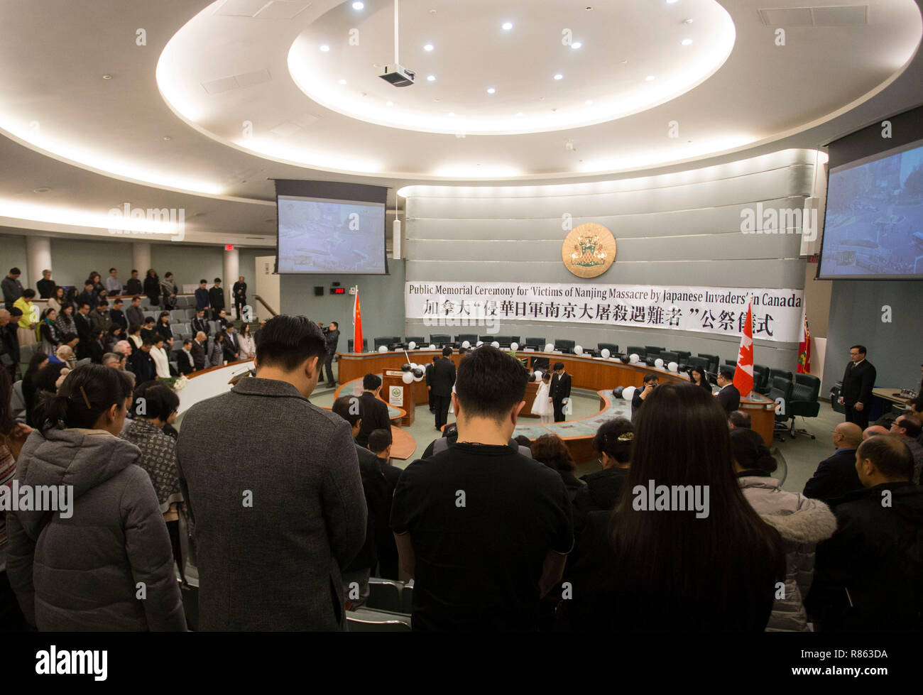 Markham, Canada. 13th Dec, 2018. People attend a memorial ceremony on ...