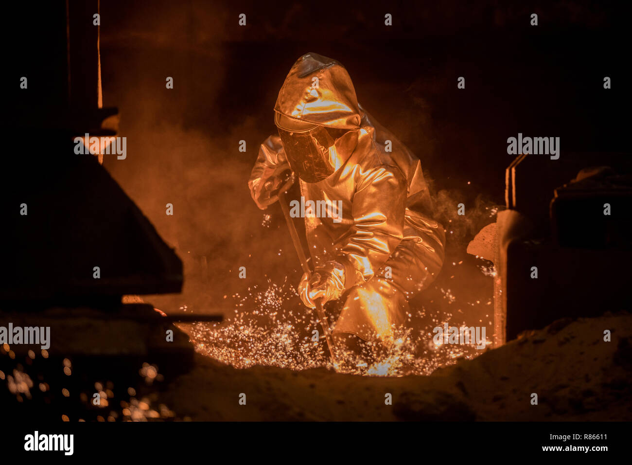 Duisburg, Germany. 10th Dec, 2018. A blast furnace operator takes a ...