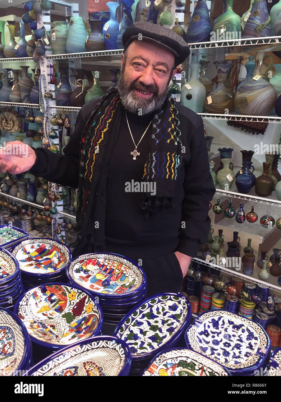 Bethlehem, Israel. 12th Dec, 2018. The merchant Efram Shahin stands in ...